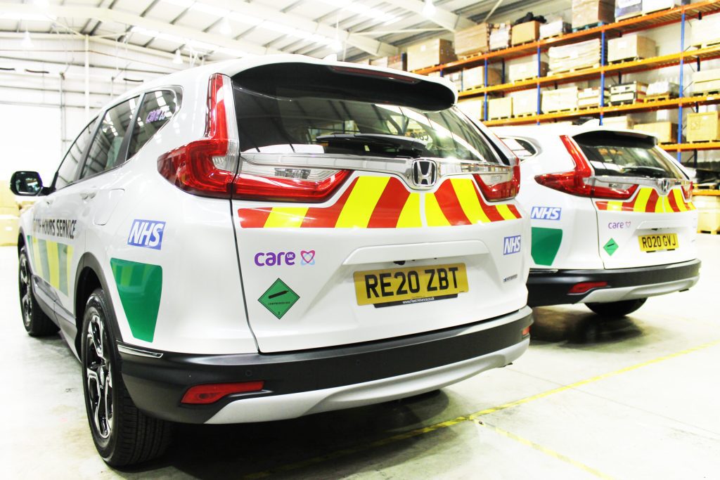 Installing signage for a new fleet of NHS service cars! - Stone Create