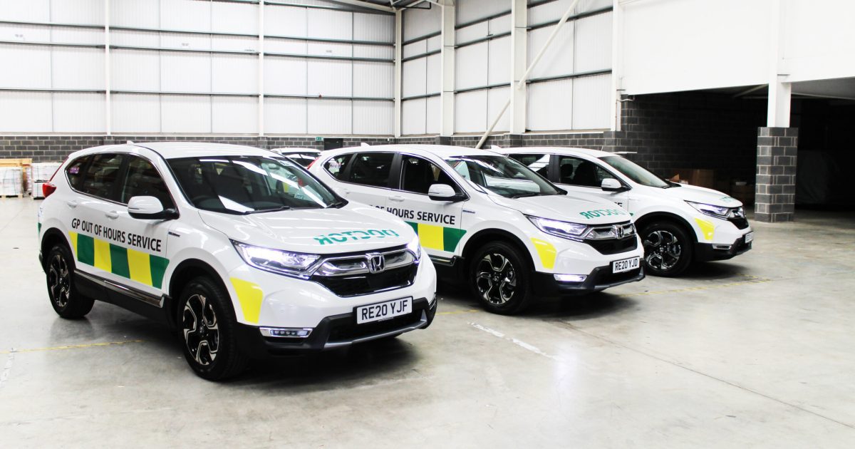 Installing signage for a new fleet of NHS service cars! - Stone Create