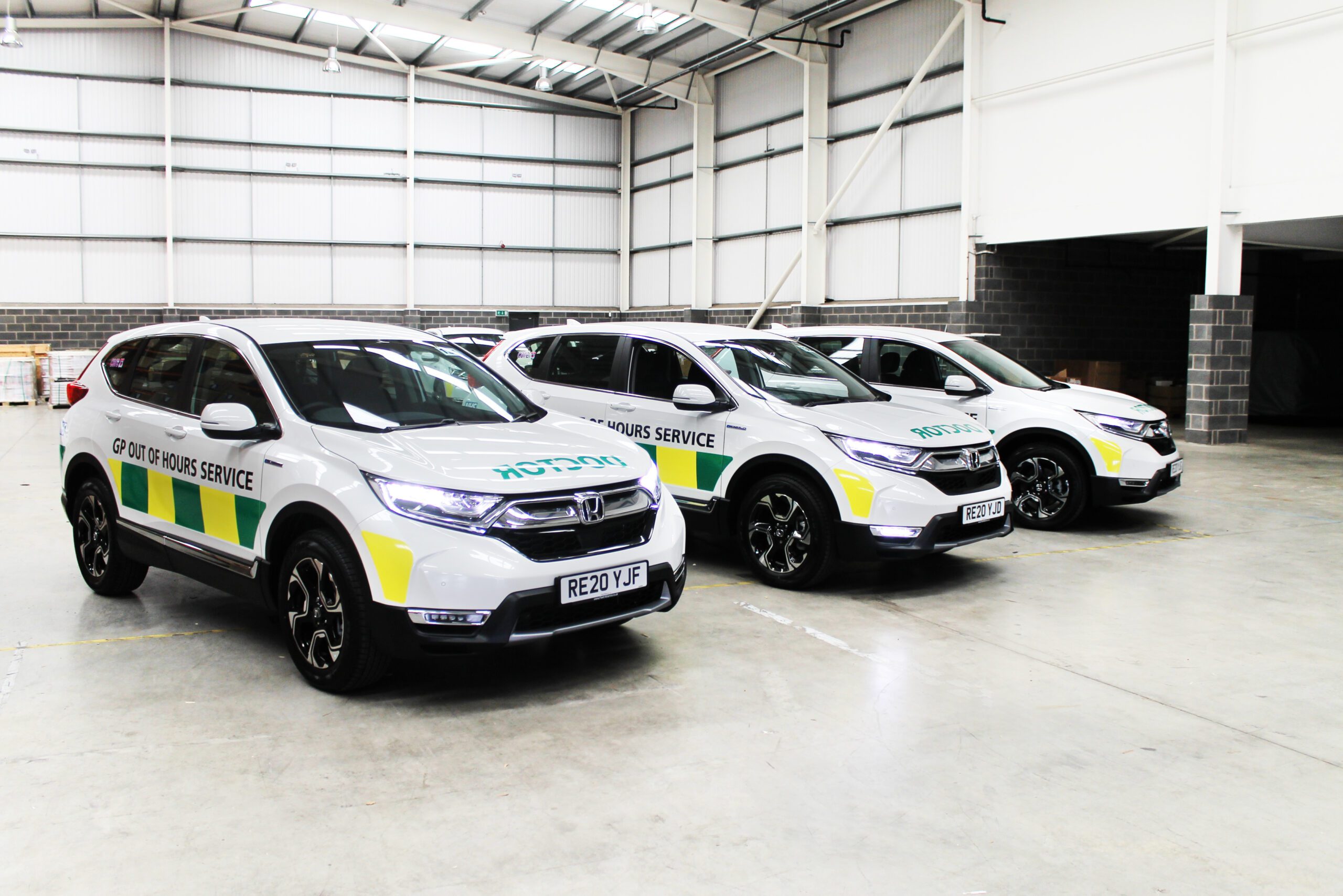Installing signage for a new fleet of NHS service cars! - Stone Create